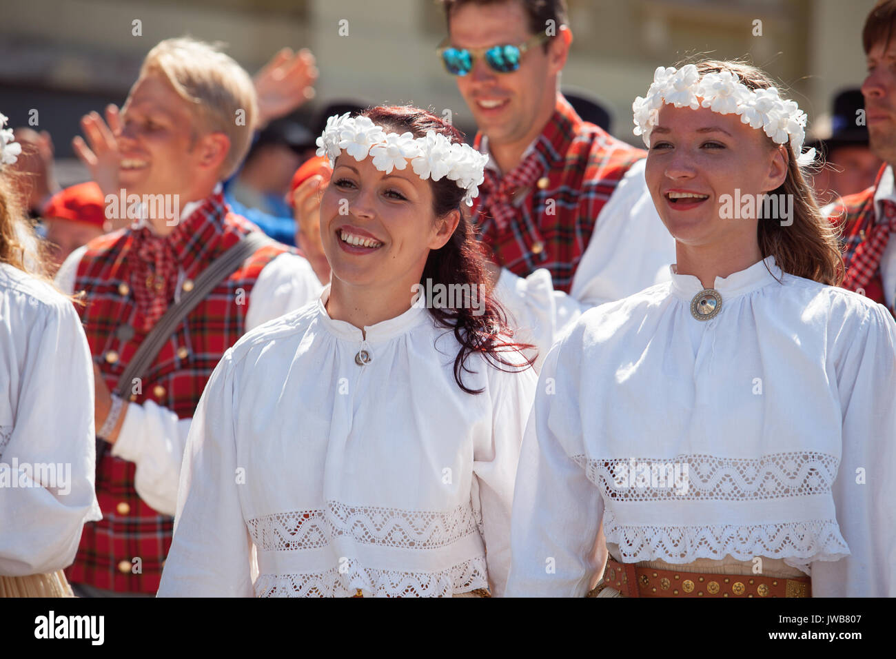 TALLINN, ESTONIA - 04 JUL 2014: People in Estonian costumes going at ...