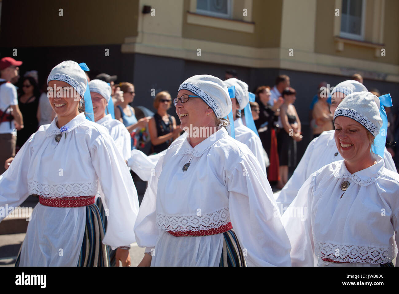 TALLINN, ESTONIA - 04 JUL 2014: People in Estonian costumes going at ...