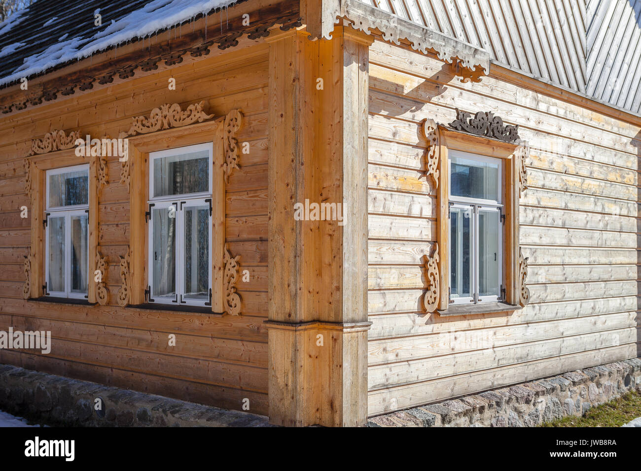 New wooden house wall in traditional carving style Stock Photo - Alamy