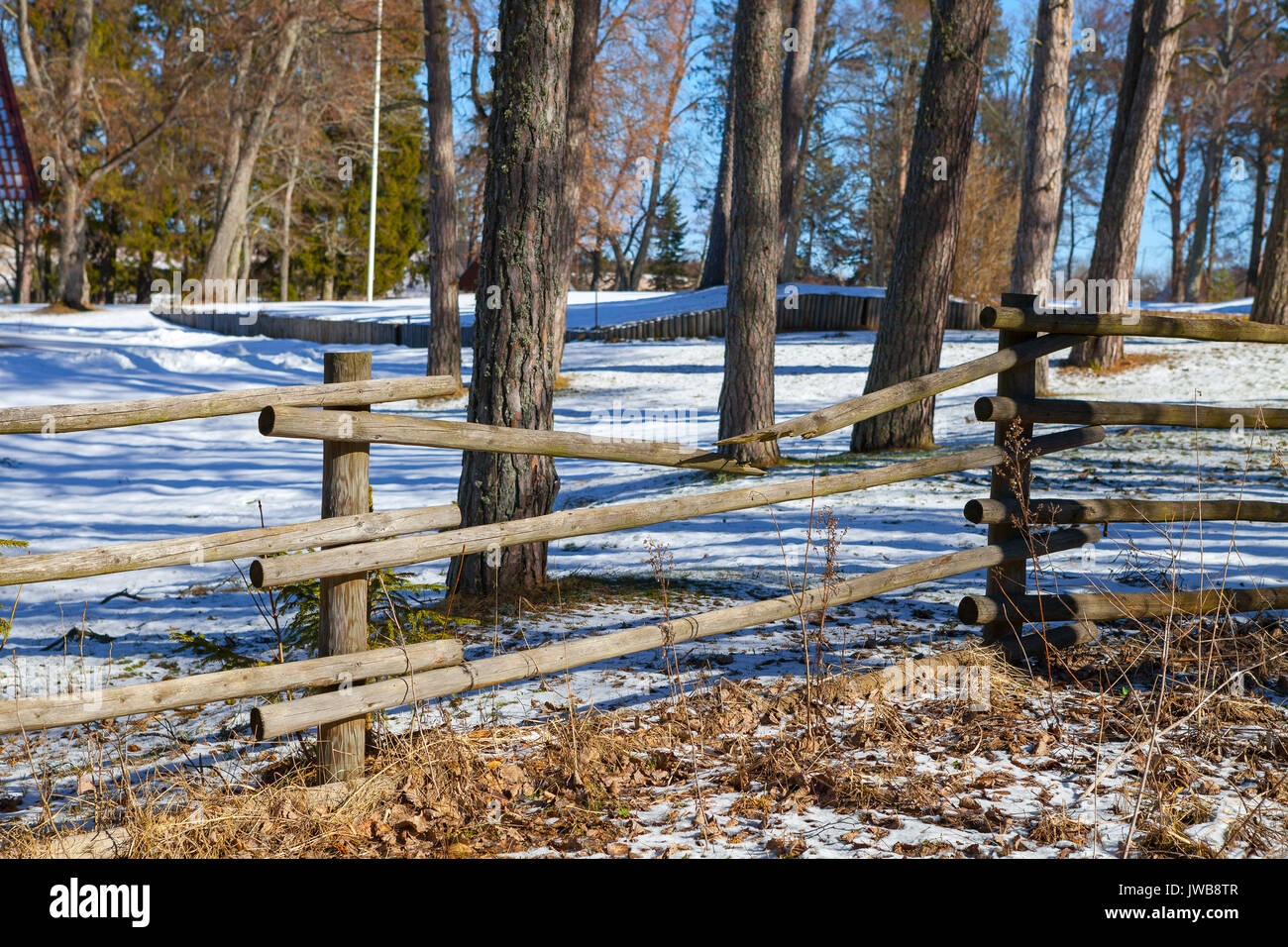 Old traditional wooden fence. Scandinavian style. Winter scene Stock ...