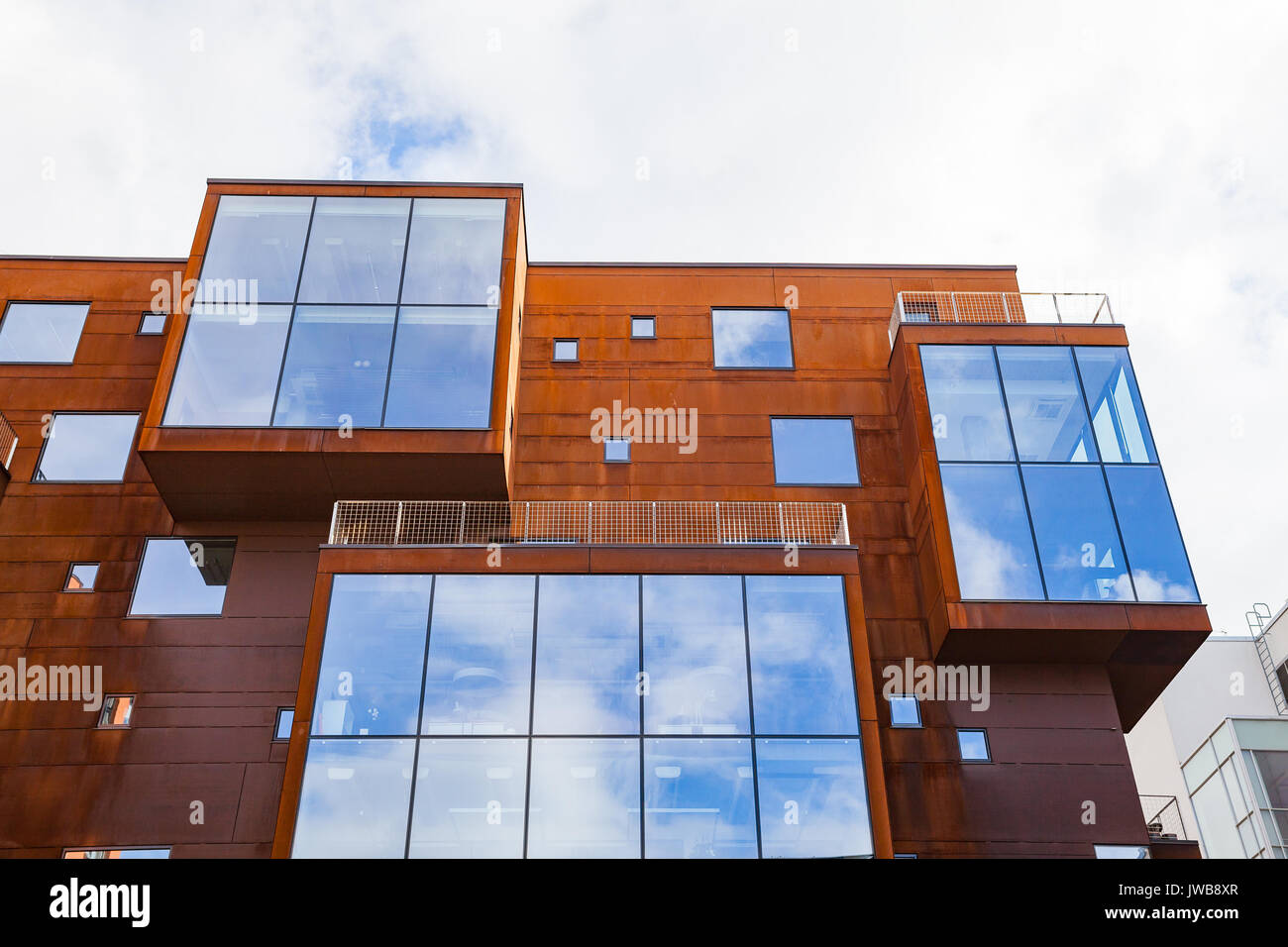 Modern architecture - rusty iron covered building with big window ...