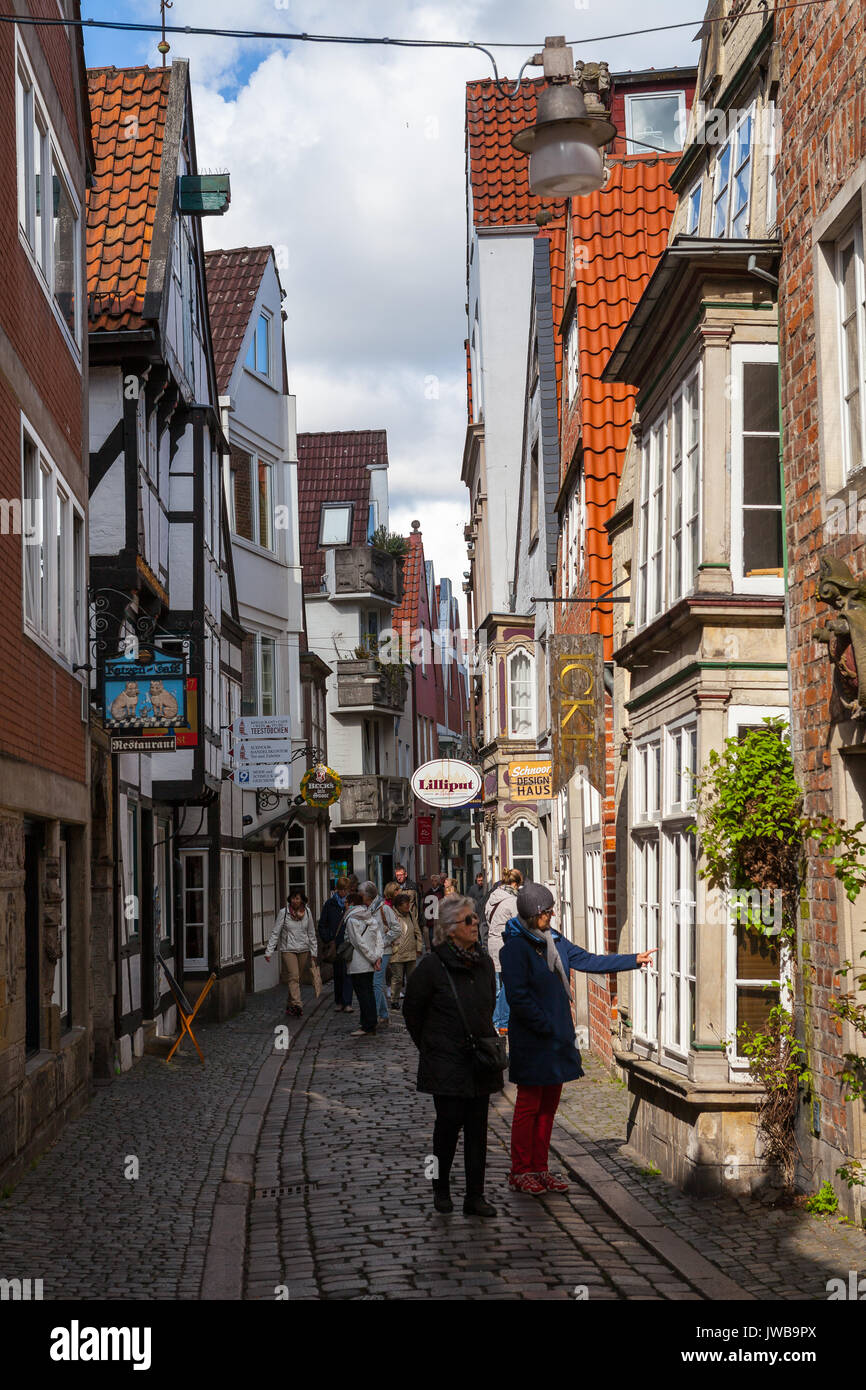 BREMEN, GERMANY - 17 APR 2016: Walking tourist couple in Schnoor ...