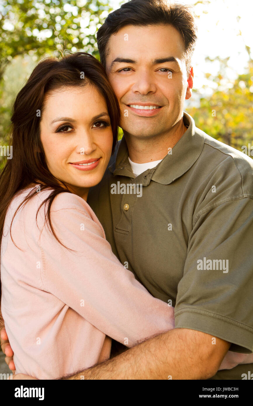 Cute happy Hispanic couple laughing and smiling Stock Photo - Alamy