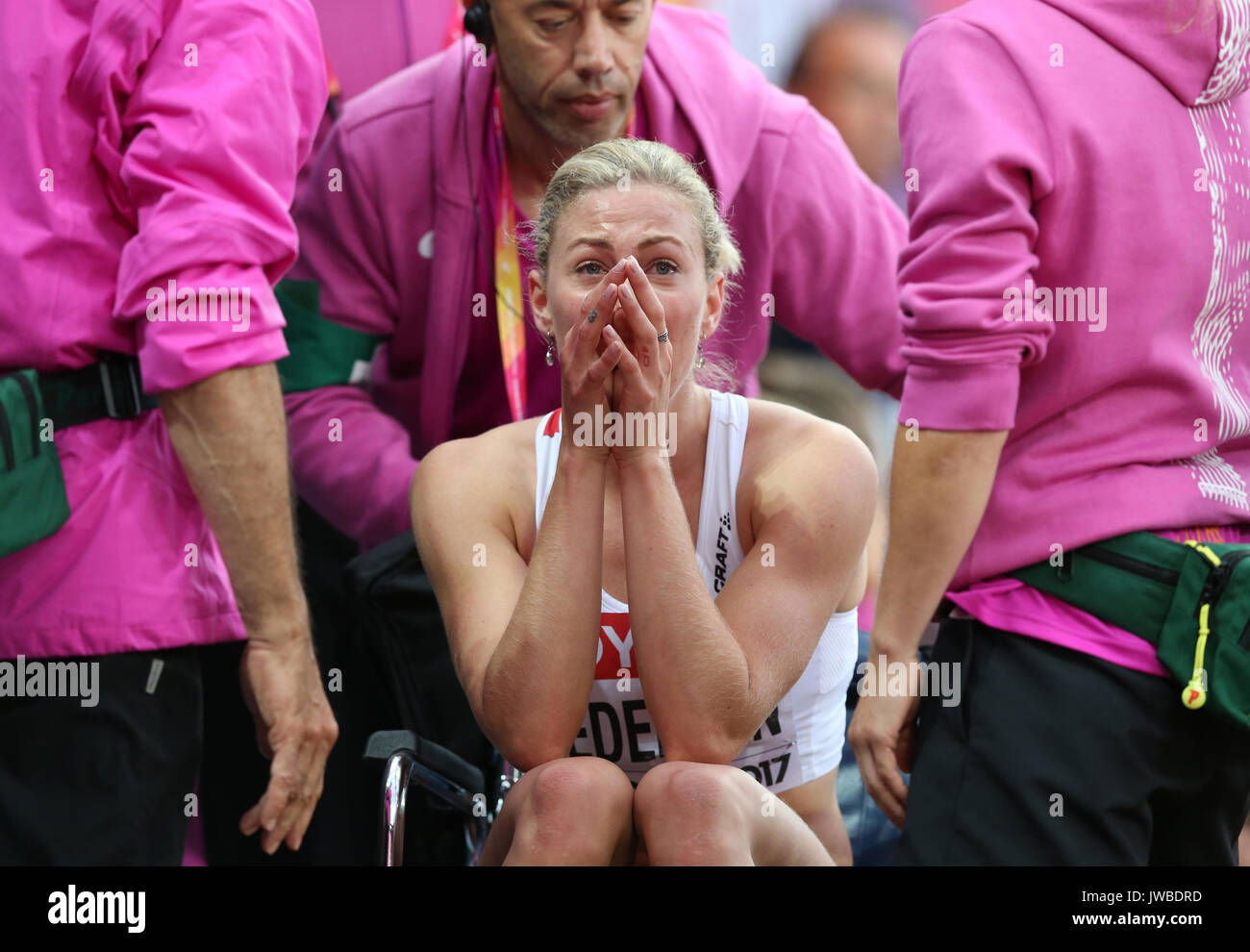 Norway's Isabelle Pedersen receives treatment for an injury in the ...