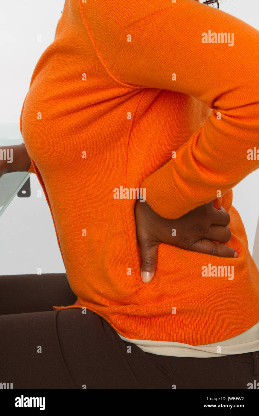 African American woman with head and back pain Stock Photo - Alamy