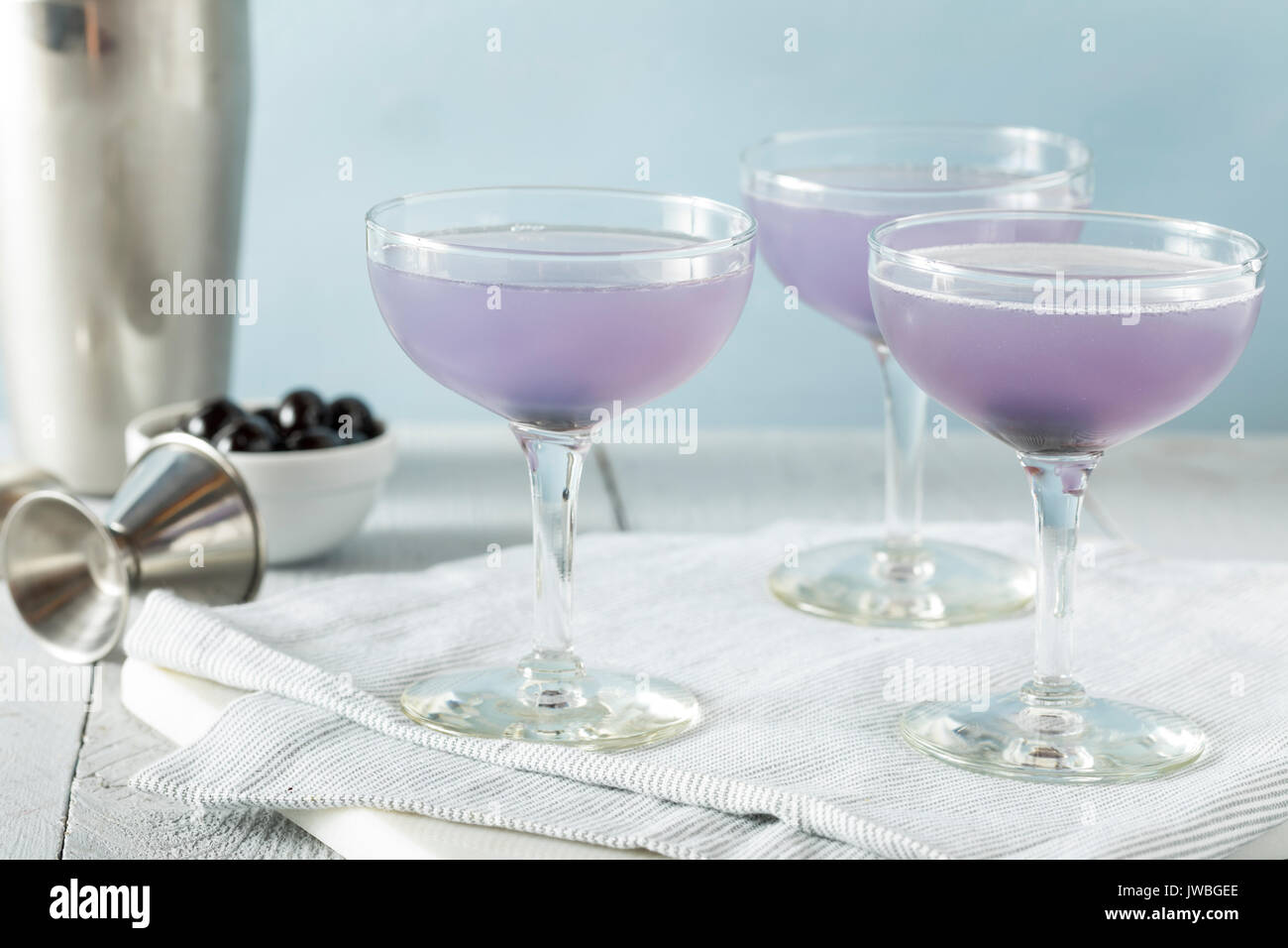 Sweet Violet Aviation Cocktail with a Cherry Garnish Stock Photo - Alamy