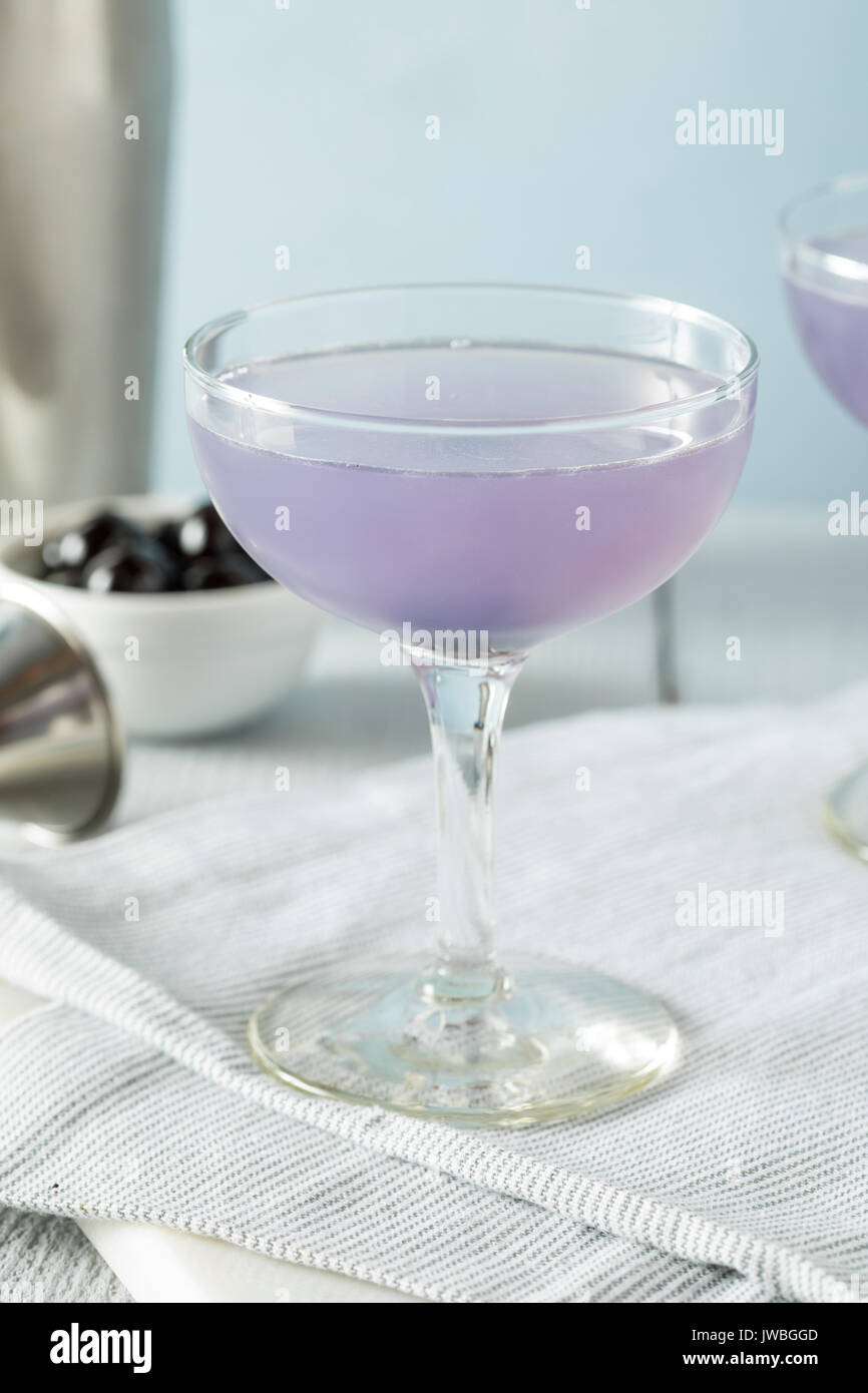 Sweet Violet Aviation Cocktail with a Cherry Garnish Stock Photo - Alamy