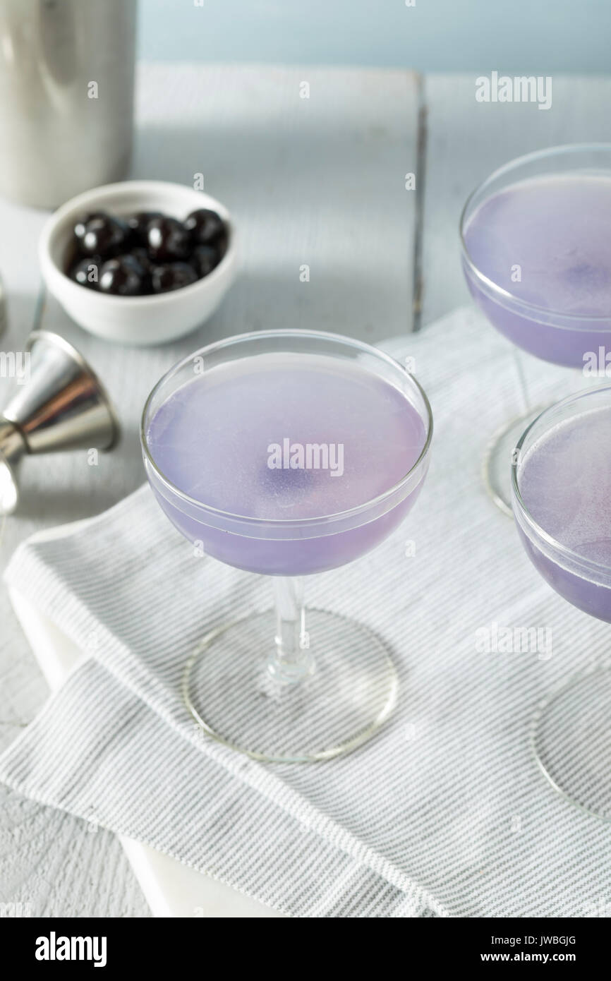 Sweet Violet Aviation Cocktail with a Cherry Garnish Stock Photo - Alamy