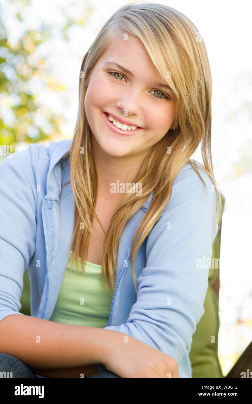Happy young teen girl outside in the backyard Stock Photo - Alamy