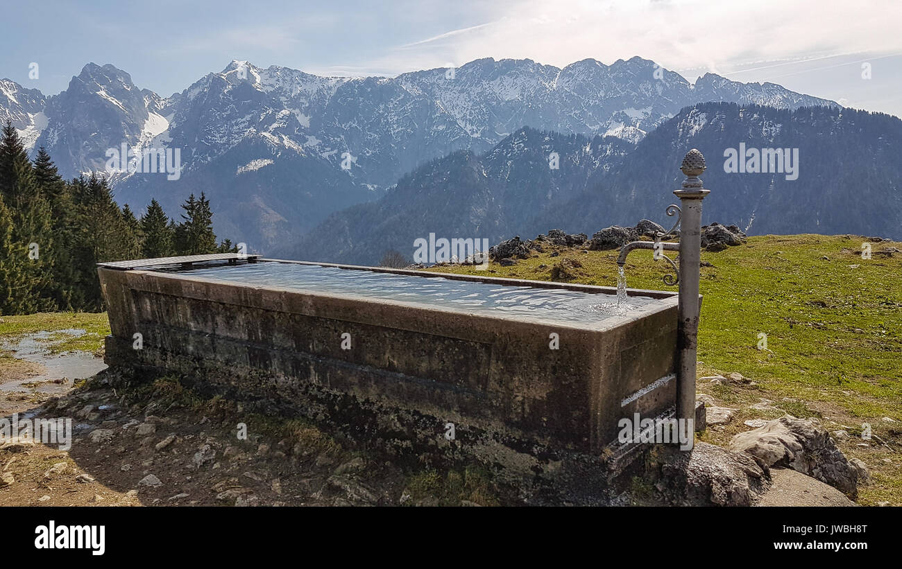 Water trough up in the mountains Stock Photo - Alamy