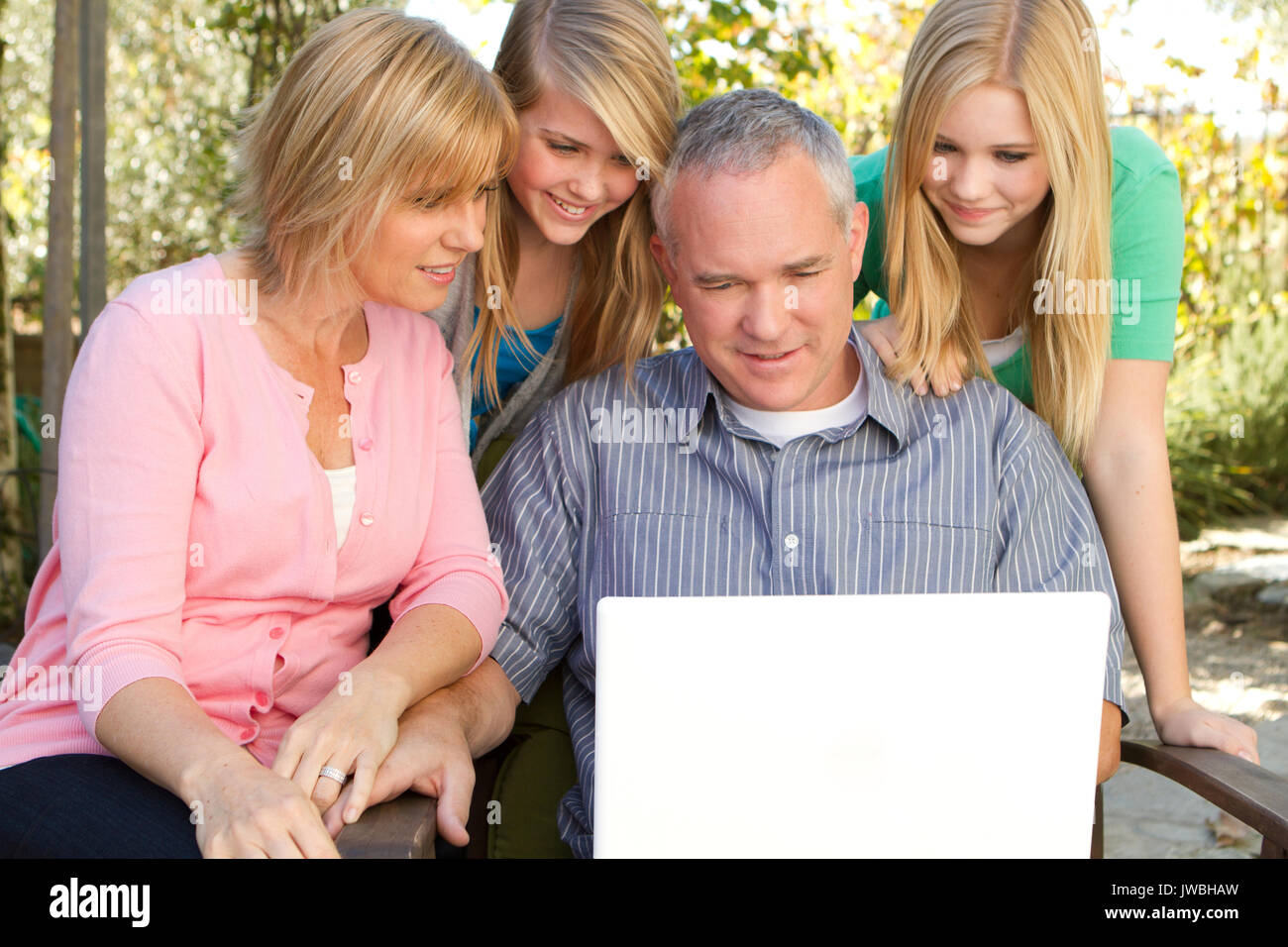 Happy family smiling Stock Photo - Alamy