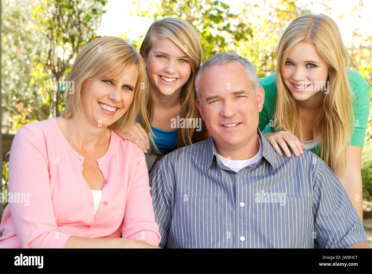 Happy family smiling Stock Photo - Alamy