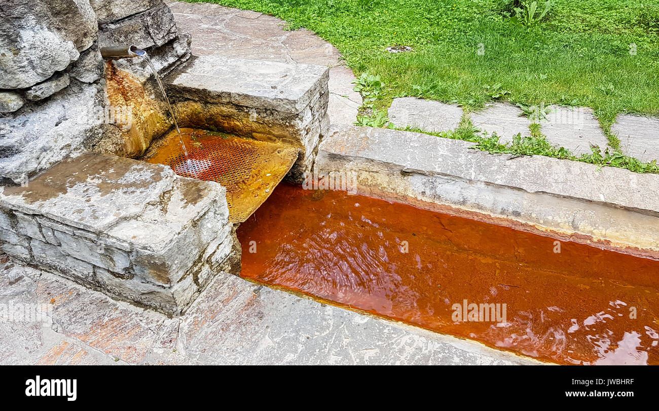 Natural mineral water spring Stock Photo - Alamy