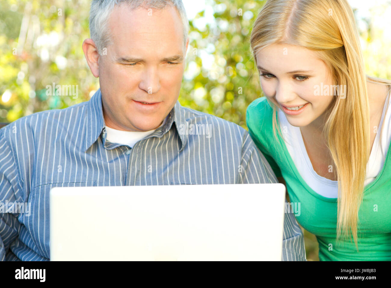 Happy family smiling Stock Photo - Alamy