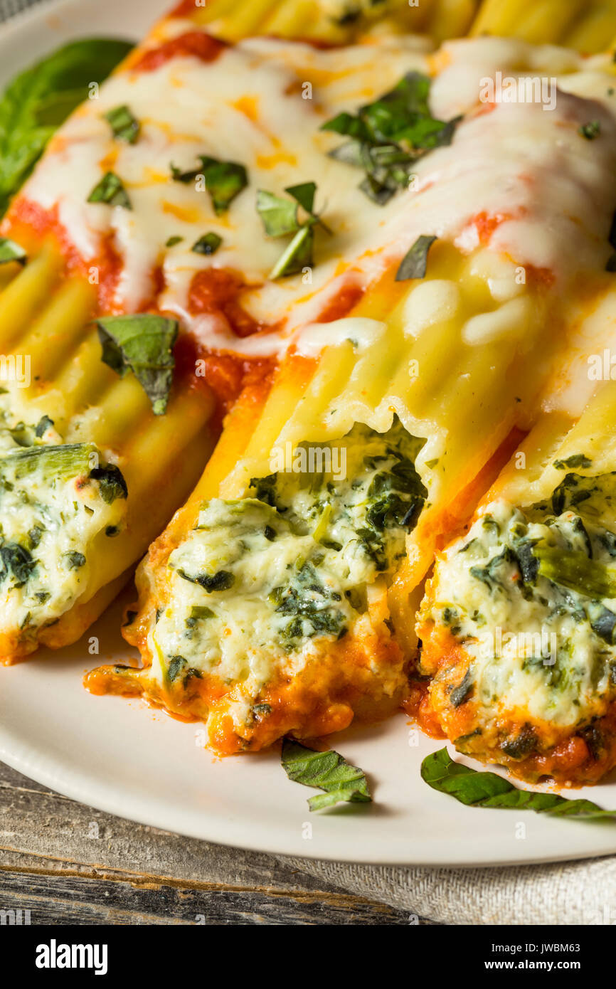 Homemade Stuffed Ricotta and Spinach Manicotti with Basil Stock Photo ...