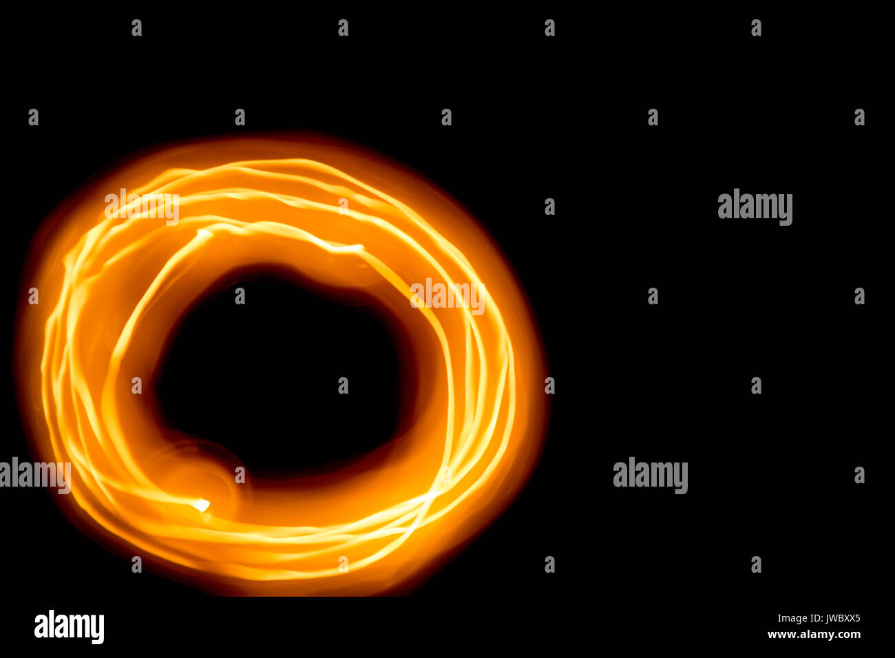 Glowing bright orange circle darkness Stock Photo - Alamy