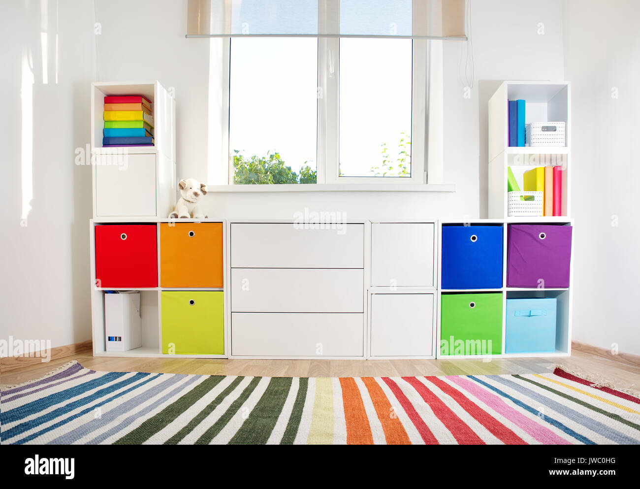 Colourful children rooom with white walls and furniture Stock Photo - Alamy