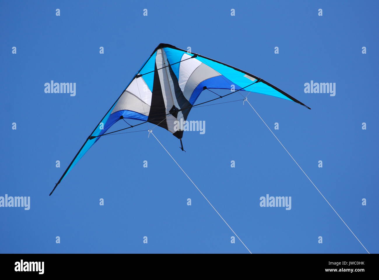 Flying white kite in blue sky with clouds hi-res stock photography and ...