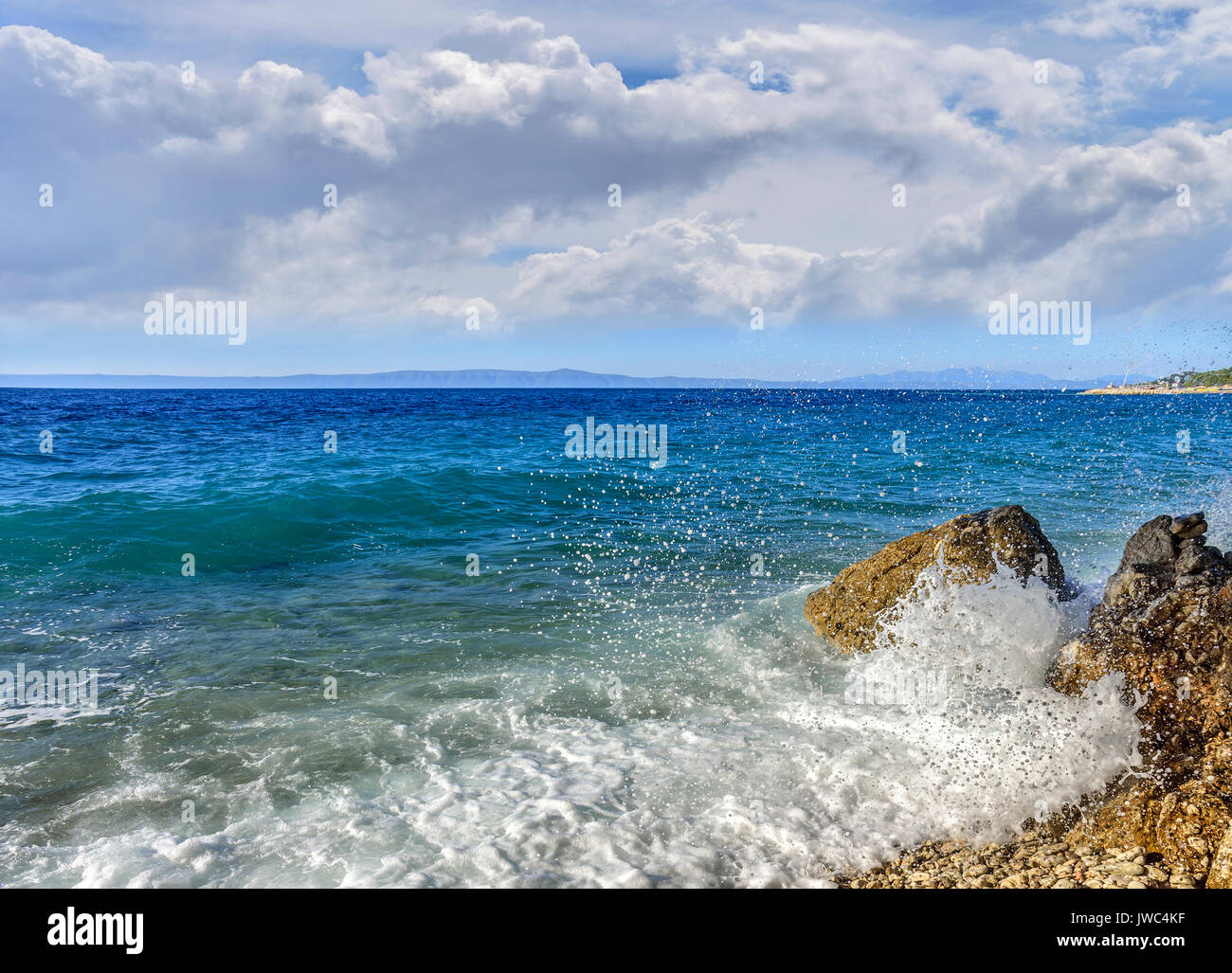 Sea beach. Sea waves crashing against the rocks on the coast Stock Photo - Alamy