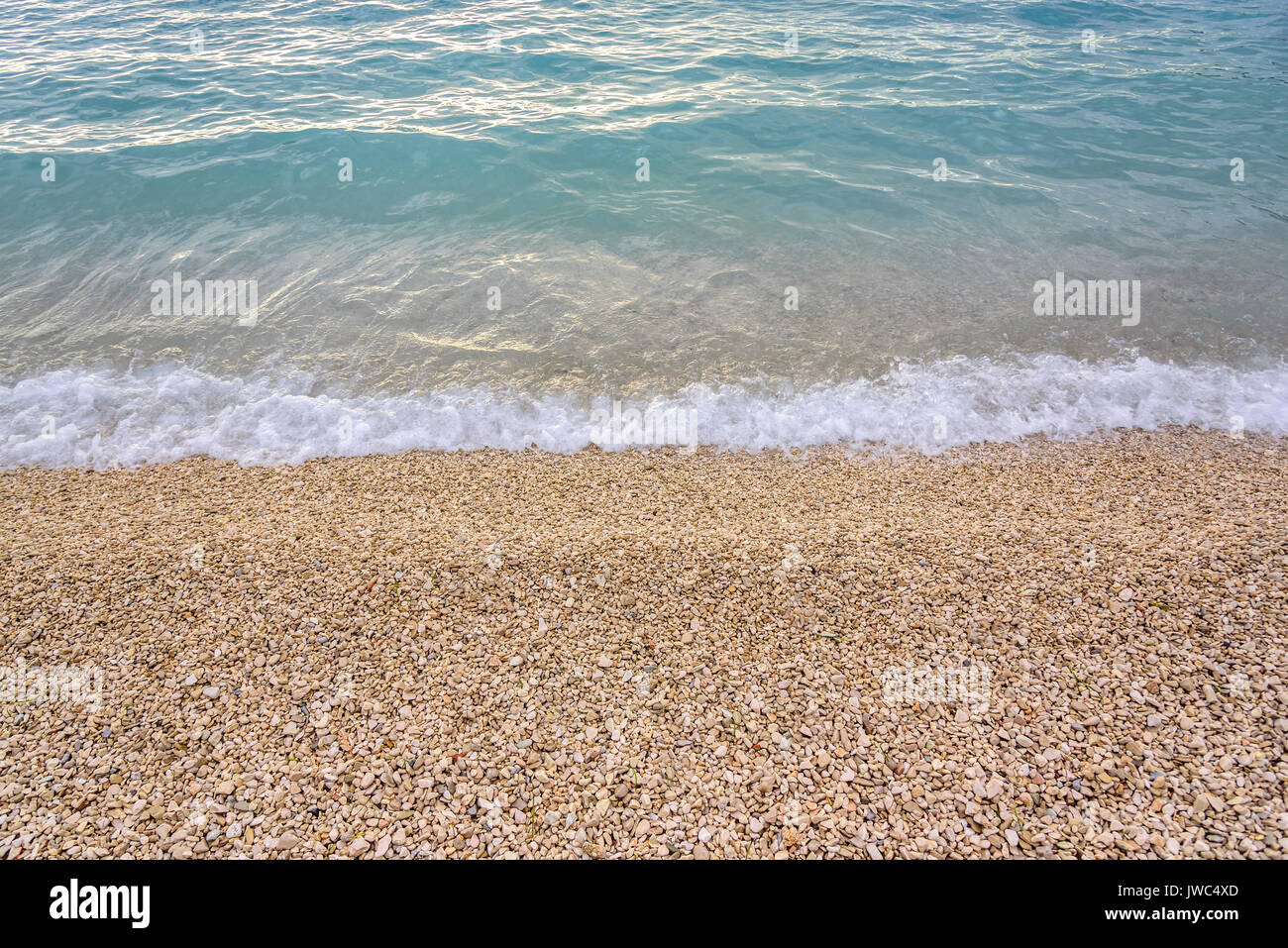 Sea surf on a stony beach Stock Photo - Alamy