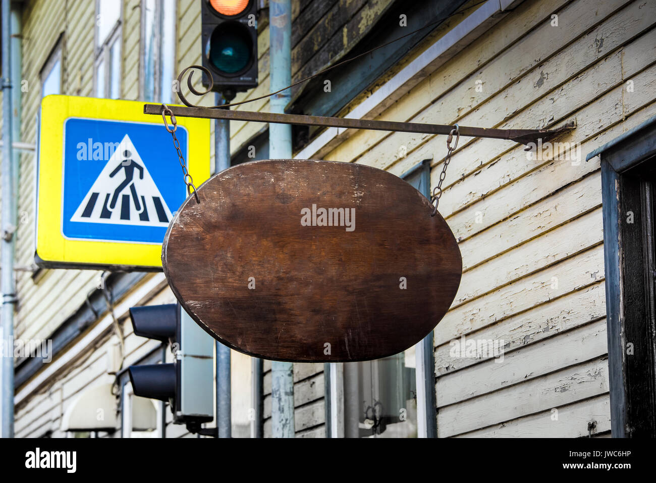 Wooden retro vintage sign on the building wall Stock Photo - Alamy