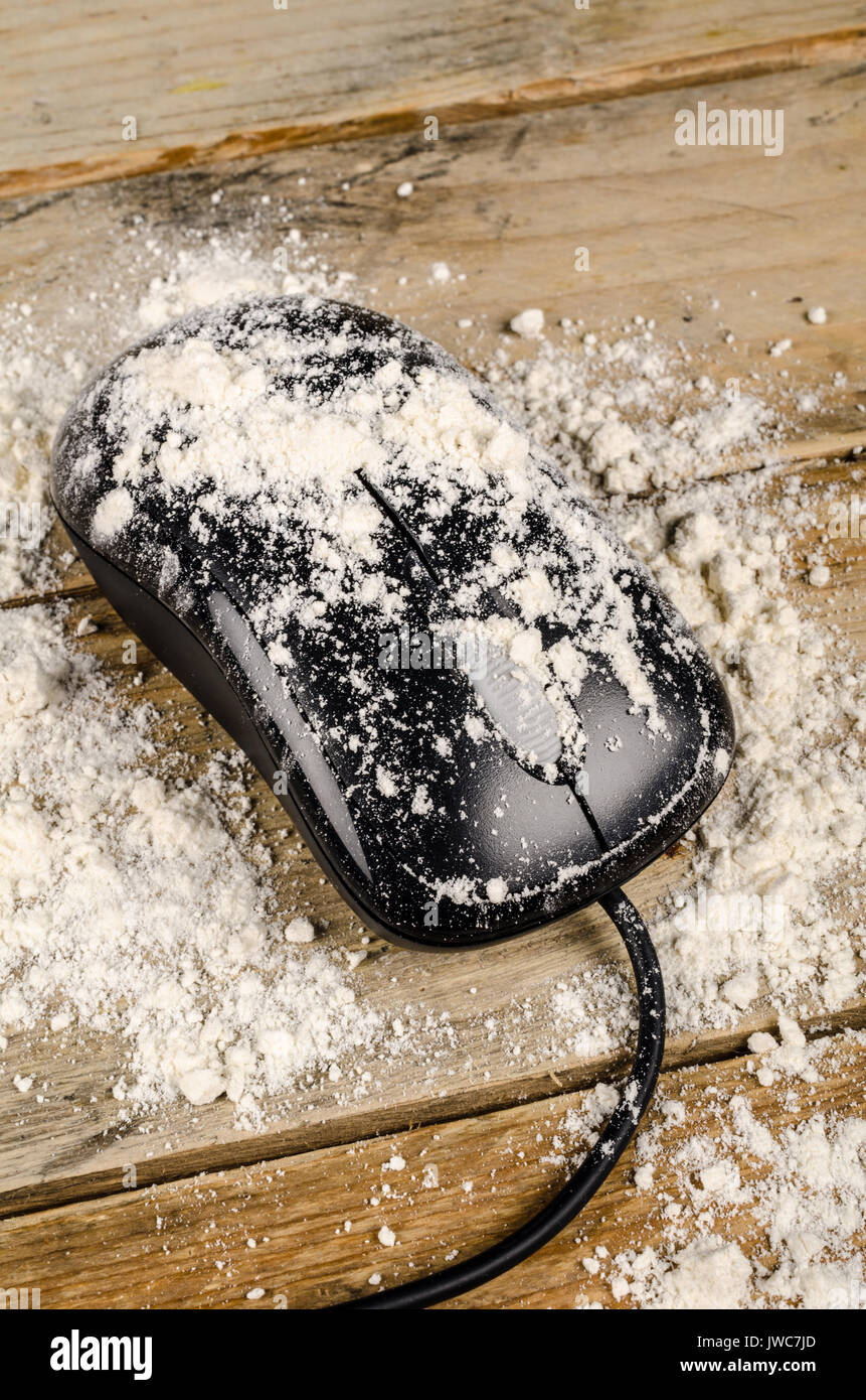 Computer mouse covered in dust, a concept Stock Photo - Alamy
