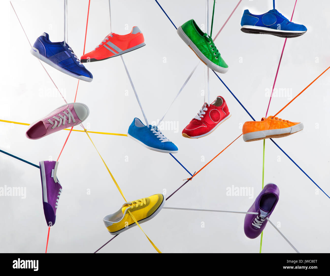 Hanging lace shoes. White background Stock Photo - Alamy