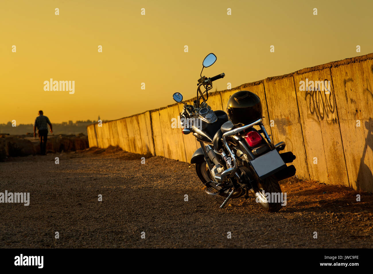 Sunset. Parked motorcycle Stock Photo - Alamy