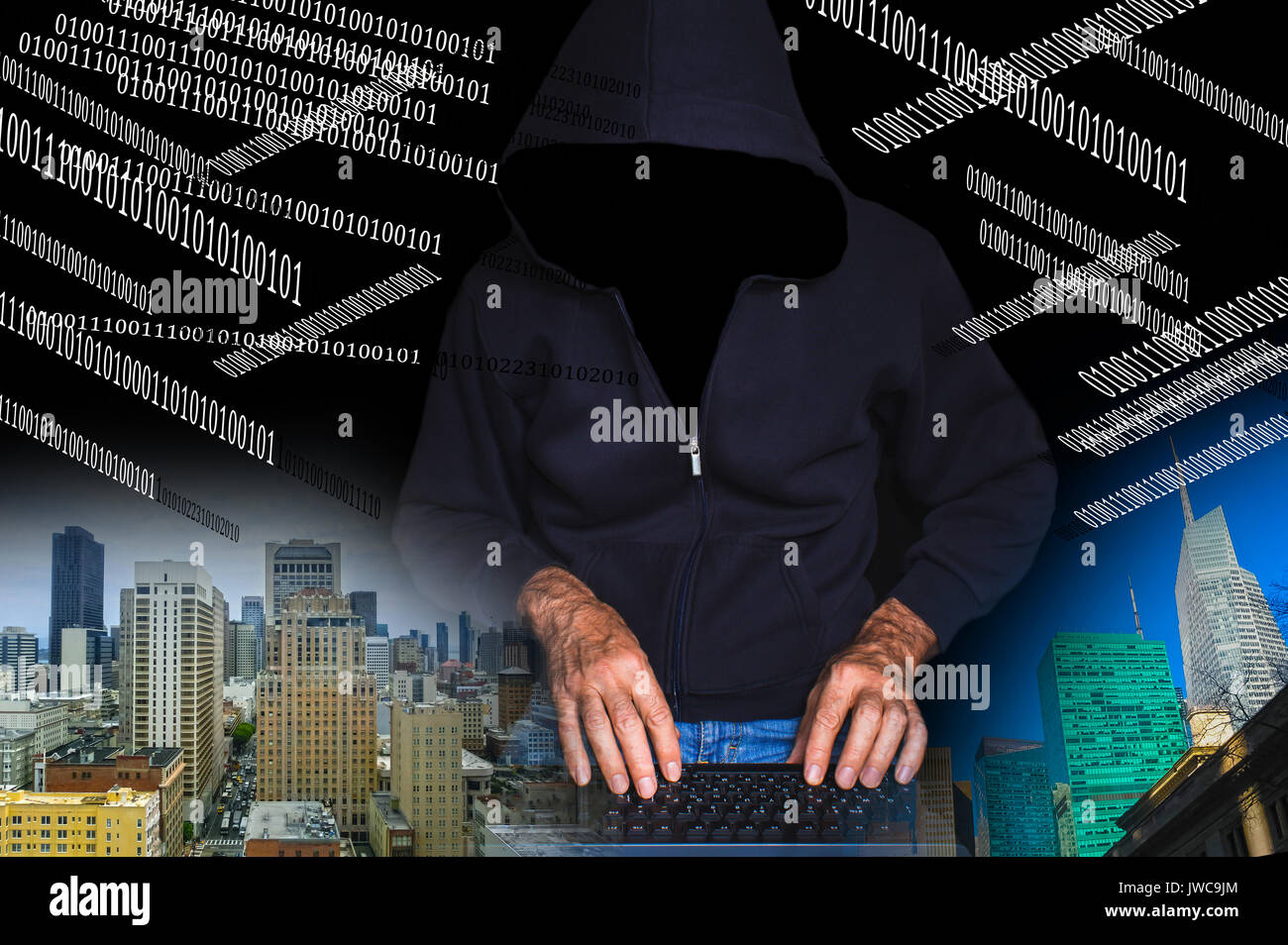 Hacker using laptop Stock Photo - Alamy