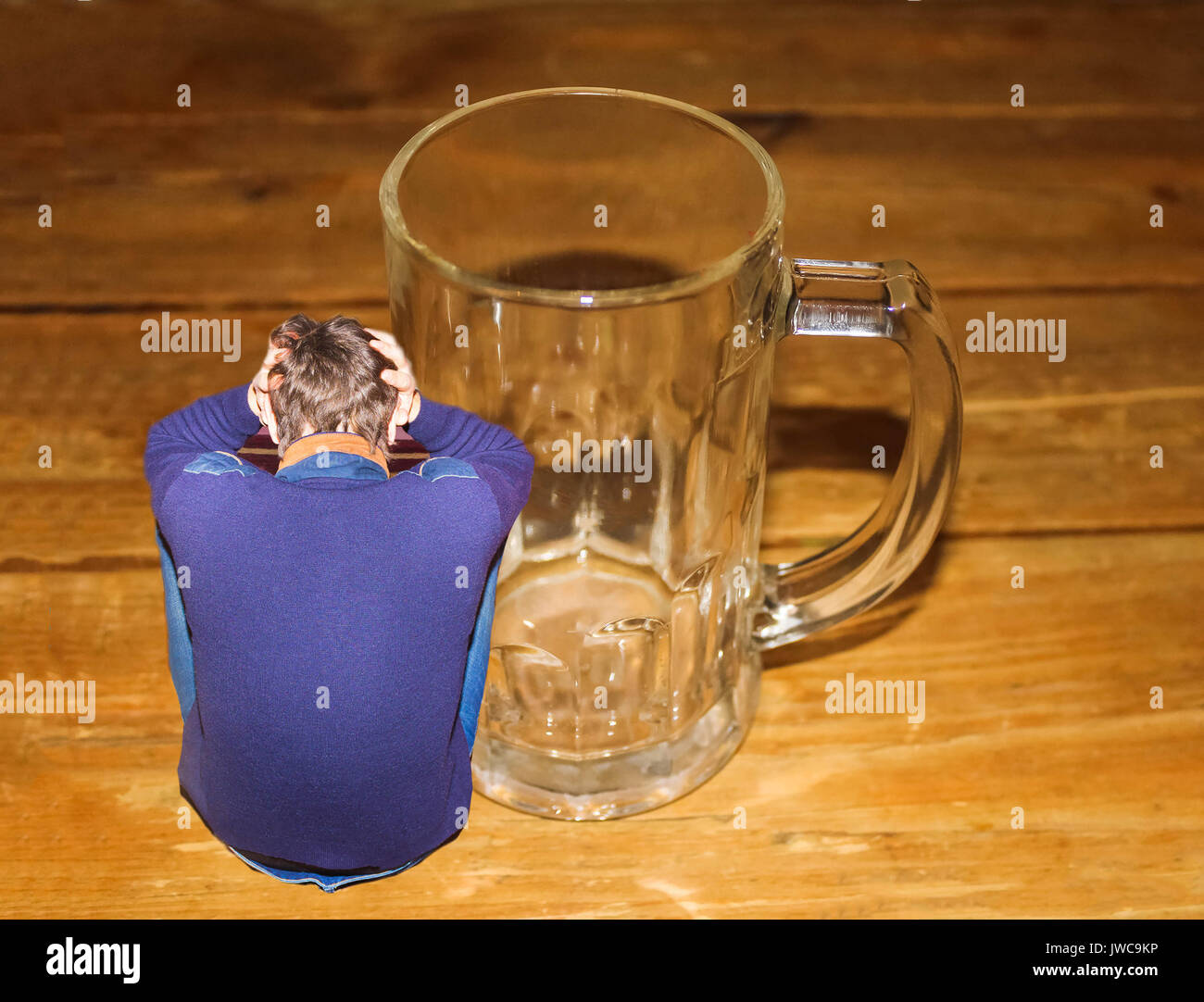 Portrait of depressed man and empty beer glass Stock Photo - Alamy