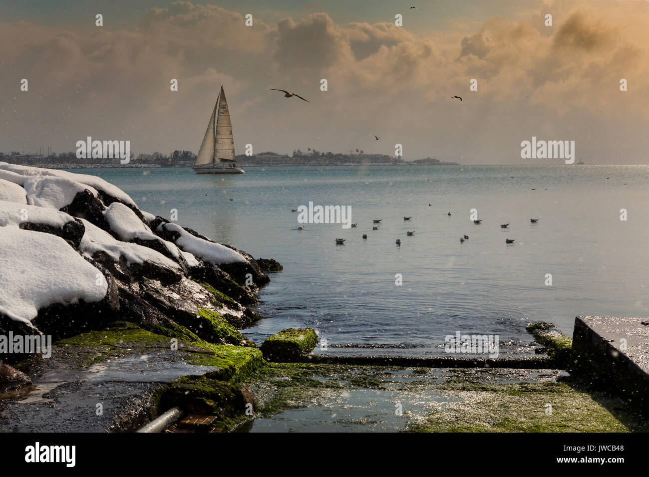 Snow and sailing. Moda beach. Istanbul - Turkey Stock Photo - Alamy