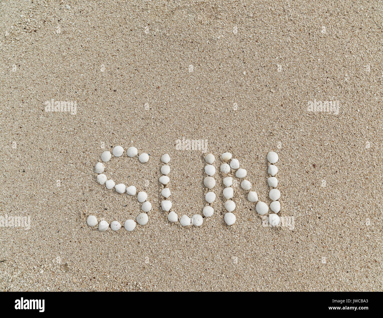 Writing with shells ''Sun'' Stock Photo - Alamy