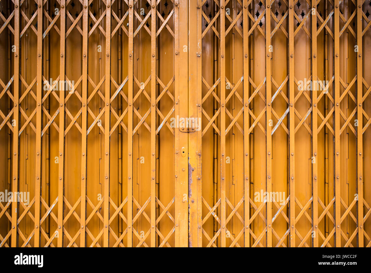 Yellow iron shutter door Stock Photo - Alamy