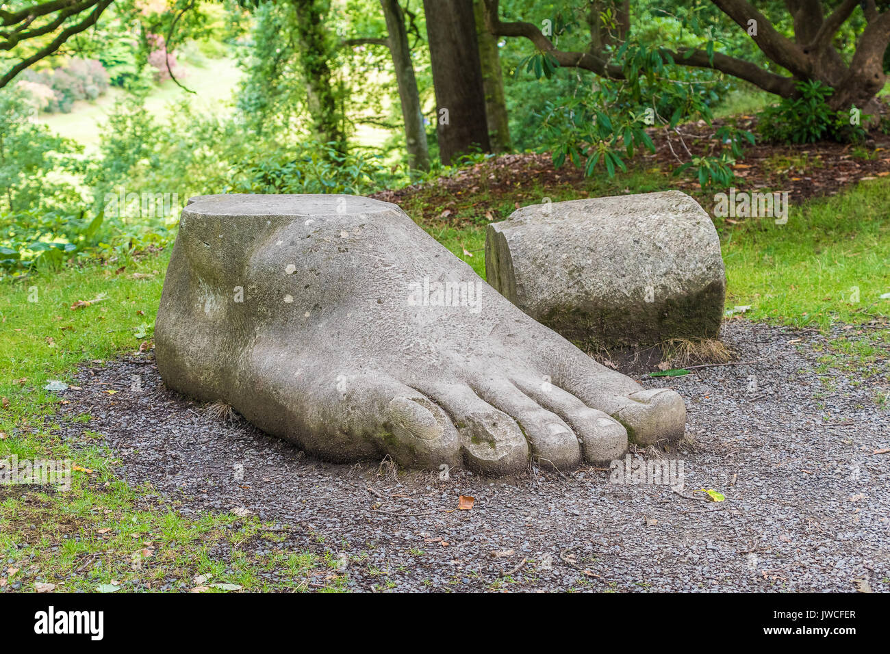 Large stone foot in a forest Stock Photo - Alamy