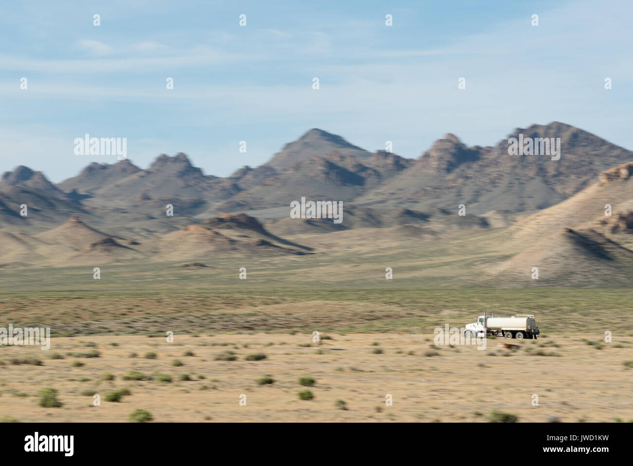 Truck on a desolate highway in the Nevada desert Stock Photo - Alamy