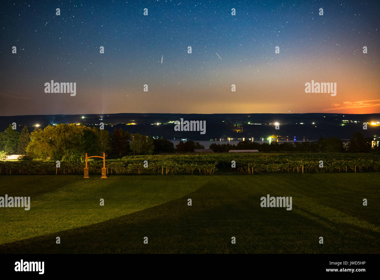 Moon rising over vinyard and lake under stars and milky way Stock Photo ...