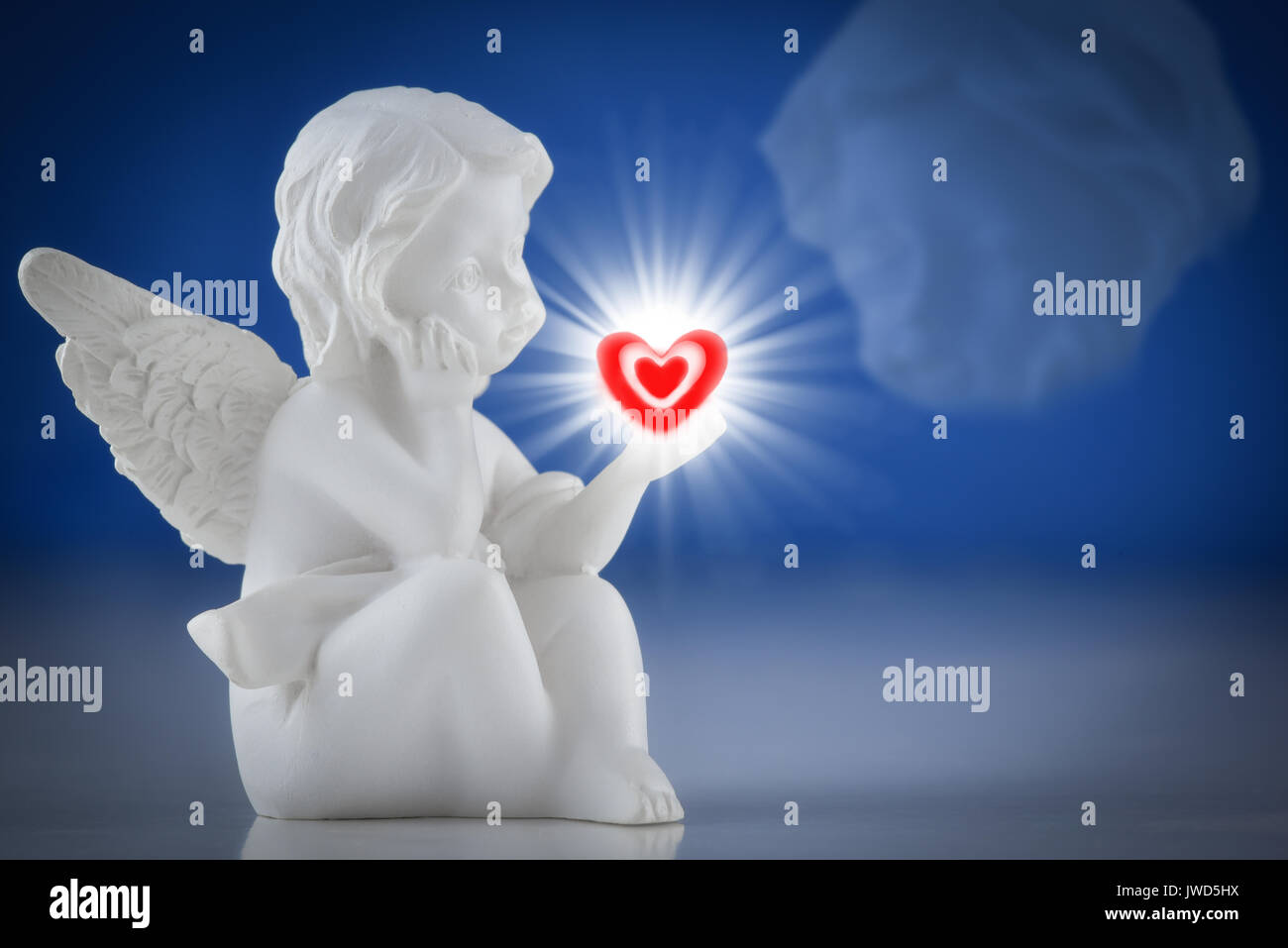 A small figure of ceramic angel toy in different compositions Stock ...