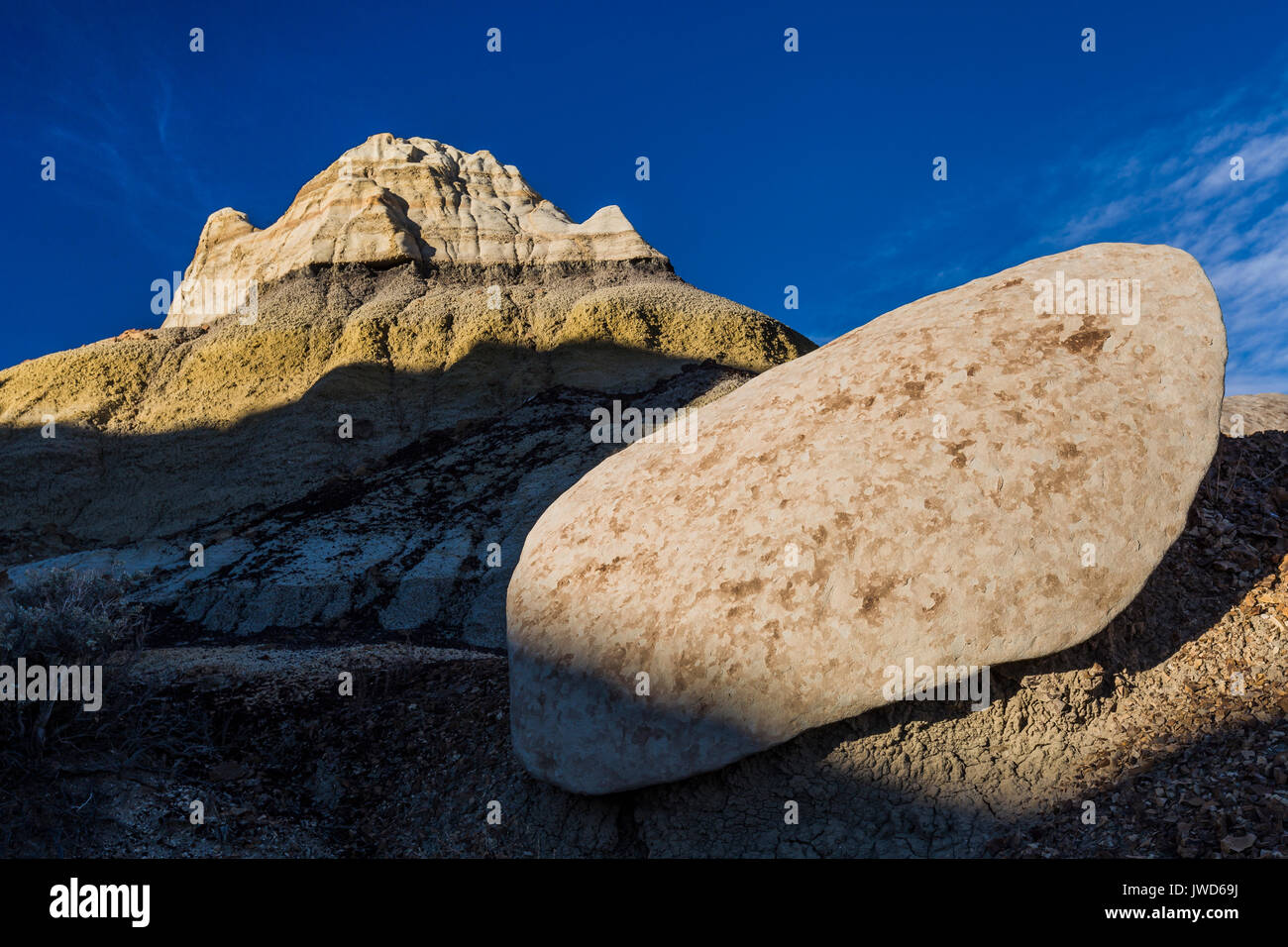 Fallen caprock emerging from a morning shadow in the Bisti/De-Na-Zin ...
