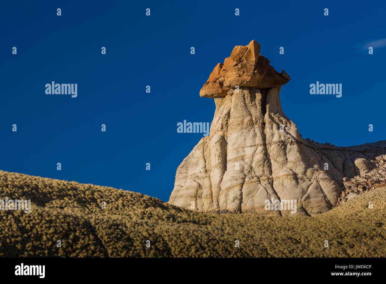 Hoodoo formation with erodable gray ash and a harder red caprock in ...