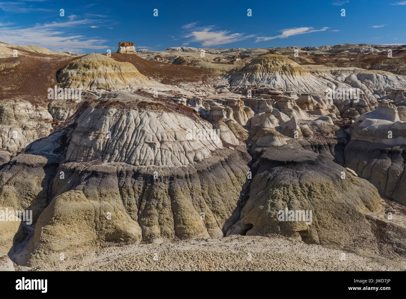 Erosional landscape with layers of black lignite, red clinkers, and ashy clay in the Bisti/De-Na ...