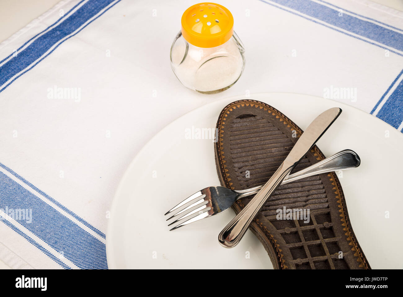 Shoe sole dished, a concept for bad cooking and tough steaks Stock ...