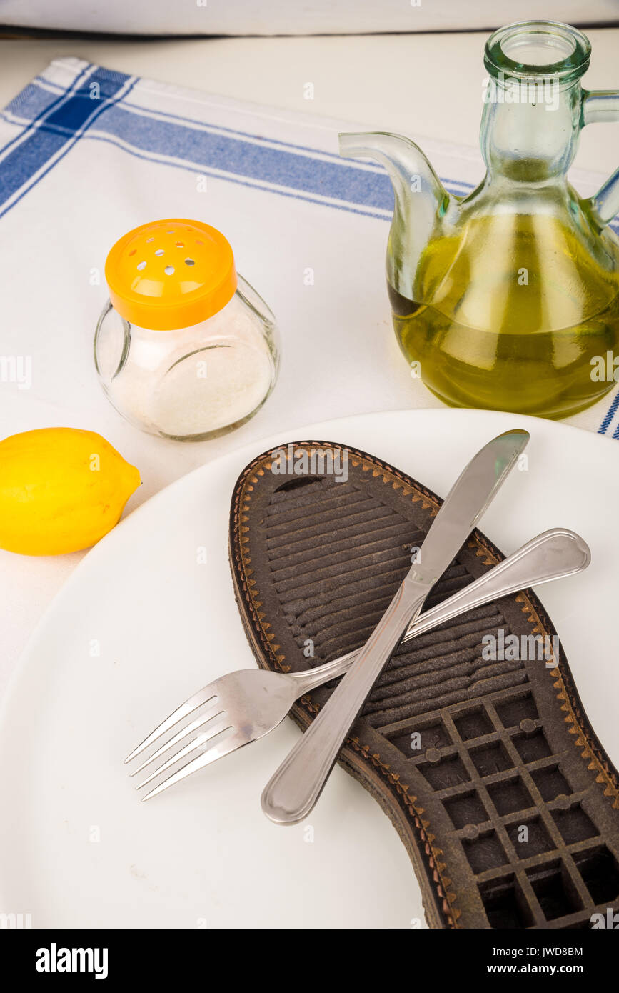 Shoe sole dished, a concept for bad cooking and tough steaks Stock ...