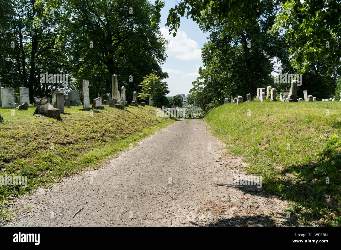 Gravel road in a graveyard located in a city Stock Photo - Alamy