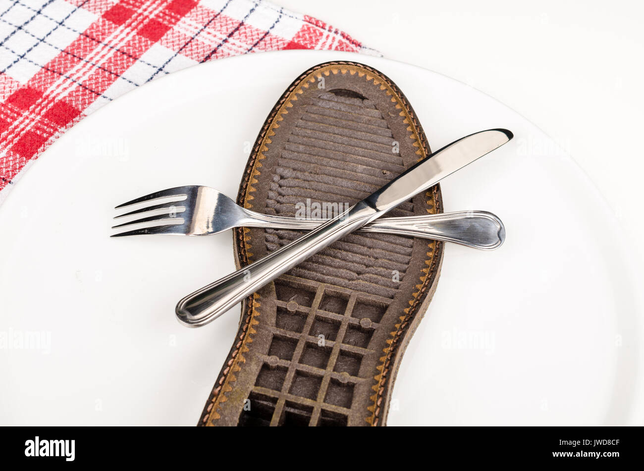 Shoe sole dished, a concept for bad cooking and tough steaks Stock ...