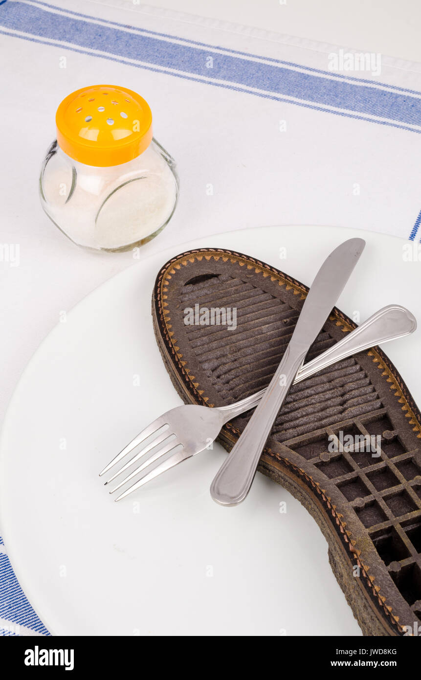 Shoe sole dished, a concept for bad cooking and tough steaks Stock ...