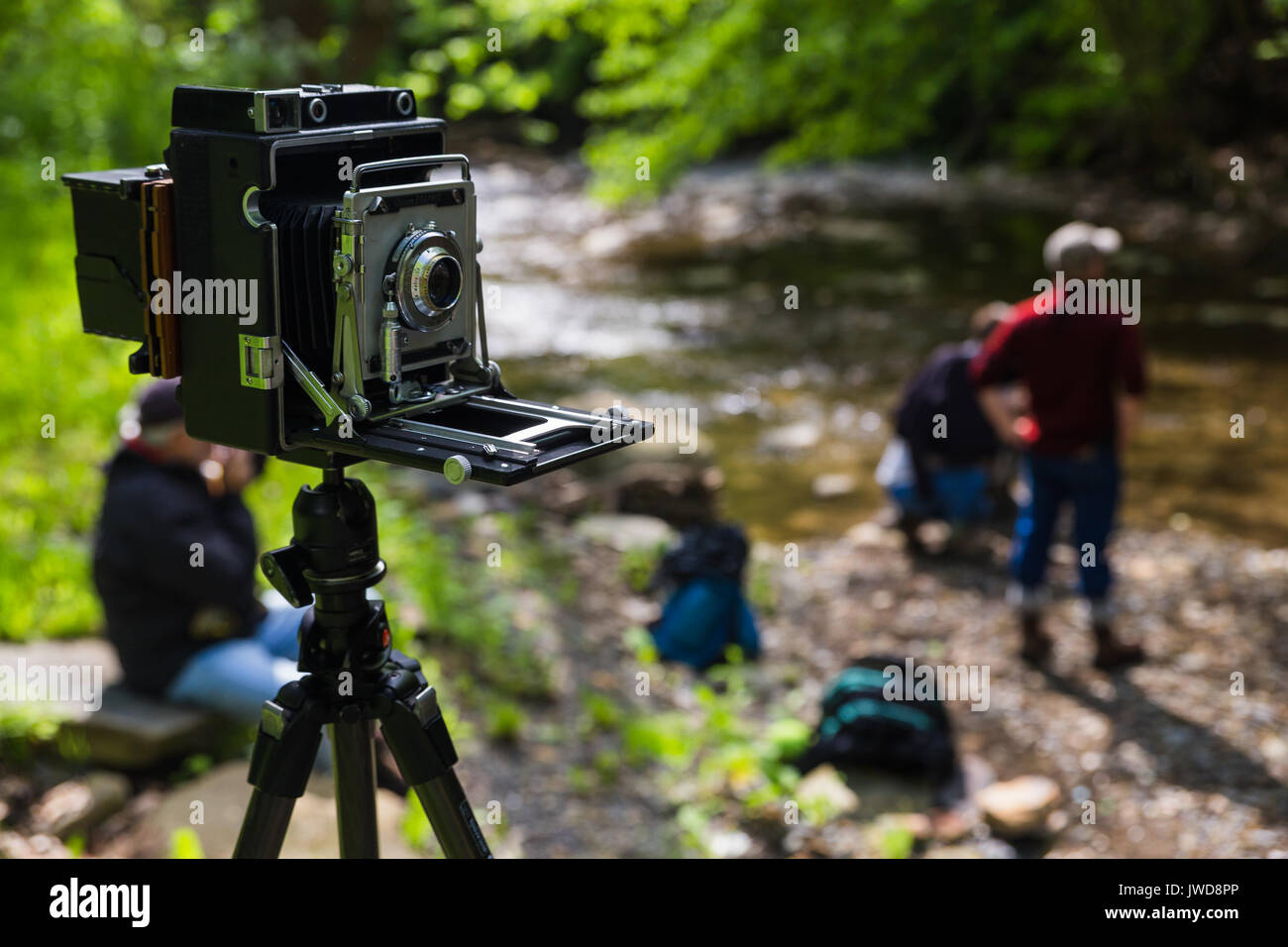 Antique large format camera near a river with people nearby Stock Photo ...