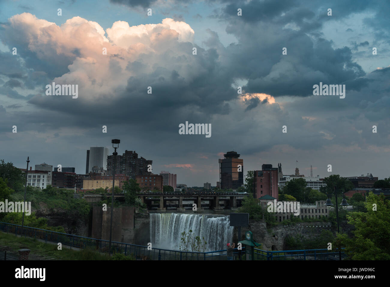 Colorful sunset sky over the high falls in downtown Rochester New York ...