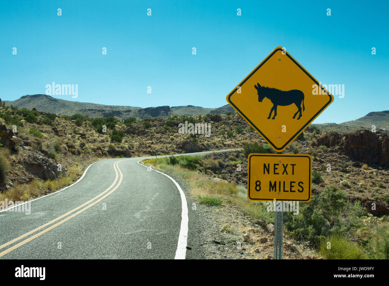 Route 66 with "Beware of Mule Crossing" Caution Sign Stock Photo - Alamy