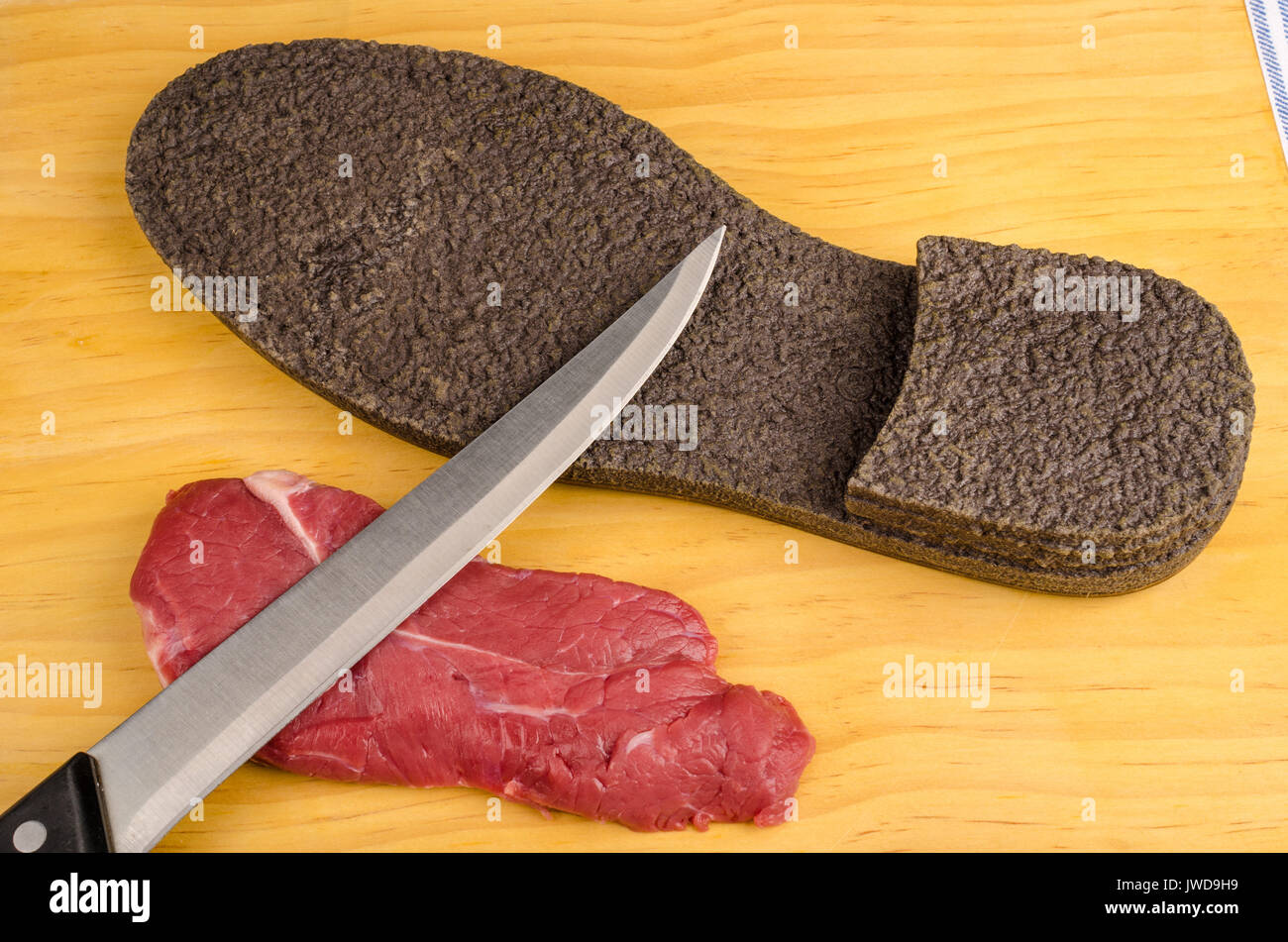 Beef steak next to a shoe sole, a poor quality meat concept Stock Photo ...
