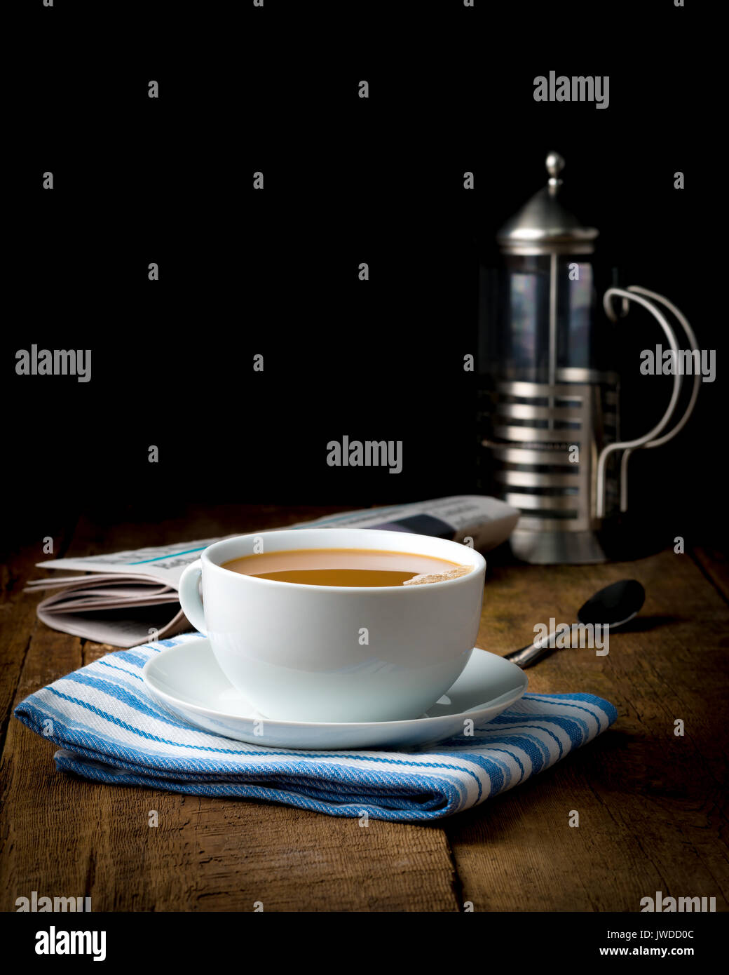 Cup of coffee with cream photographed on an artistic low key background ...